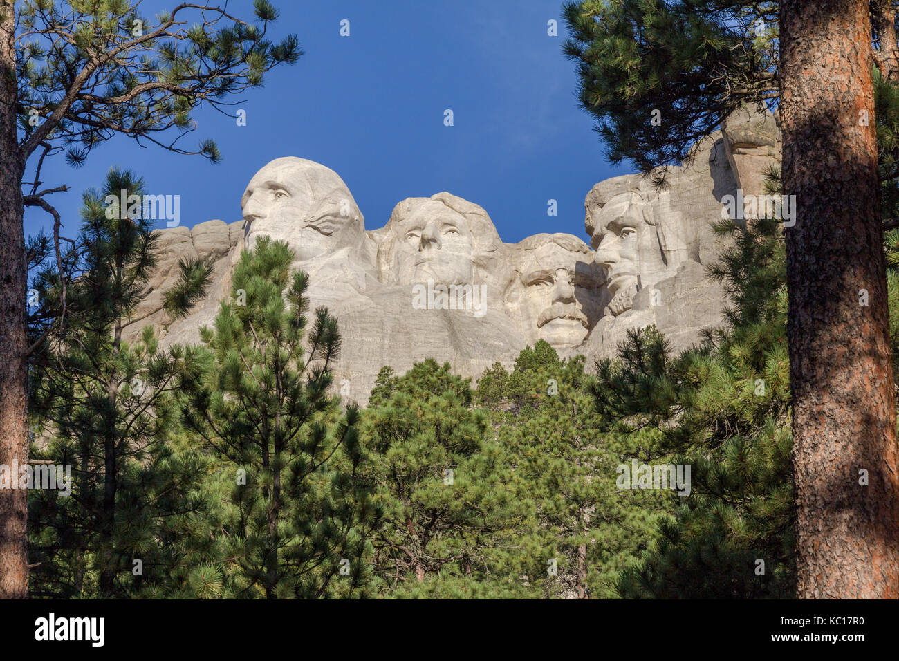 View of the presidents at Mount Rushmore as seen from the trail below ...