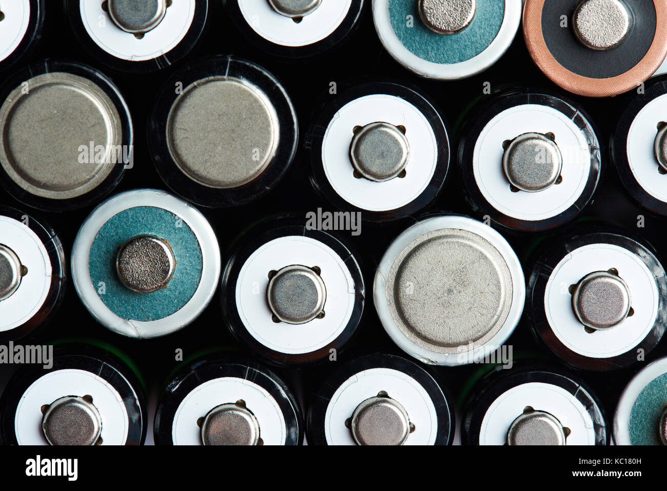 AA size battery closeup background. Group of AA batteries view from ...