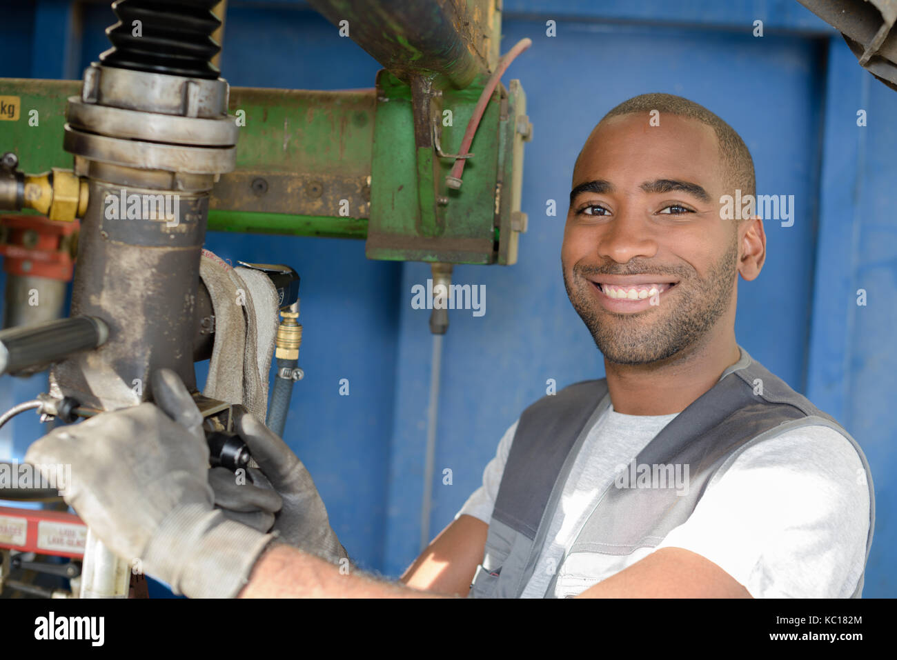 young metalworking engineer operating milling machine Stock Photo - Alamy