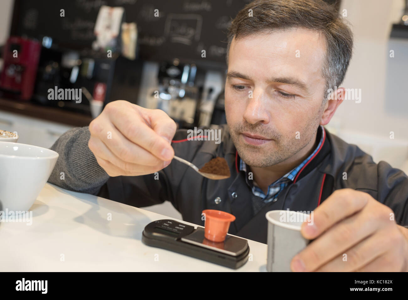 man preparing a coffee a coffee pod Stock Photo - Alamy