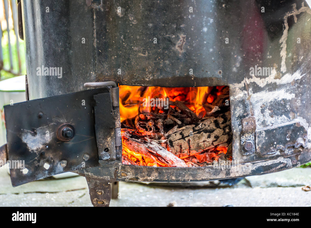 Strong fire in metal sheet cooker for roasting red pepper Stock Photo ...