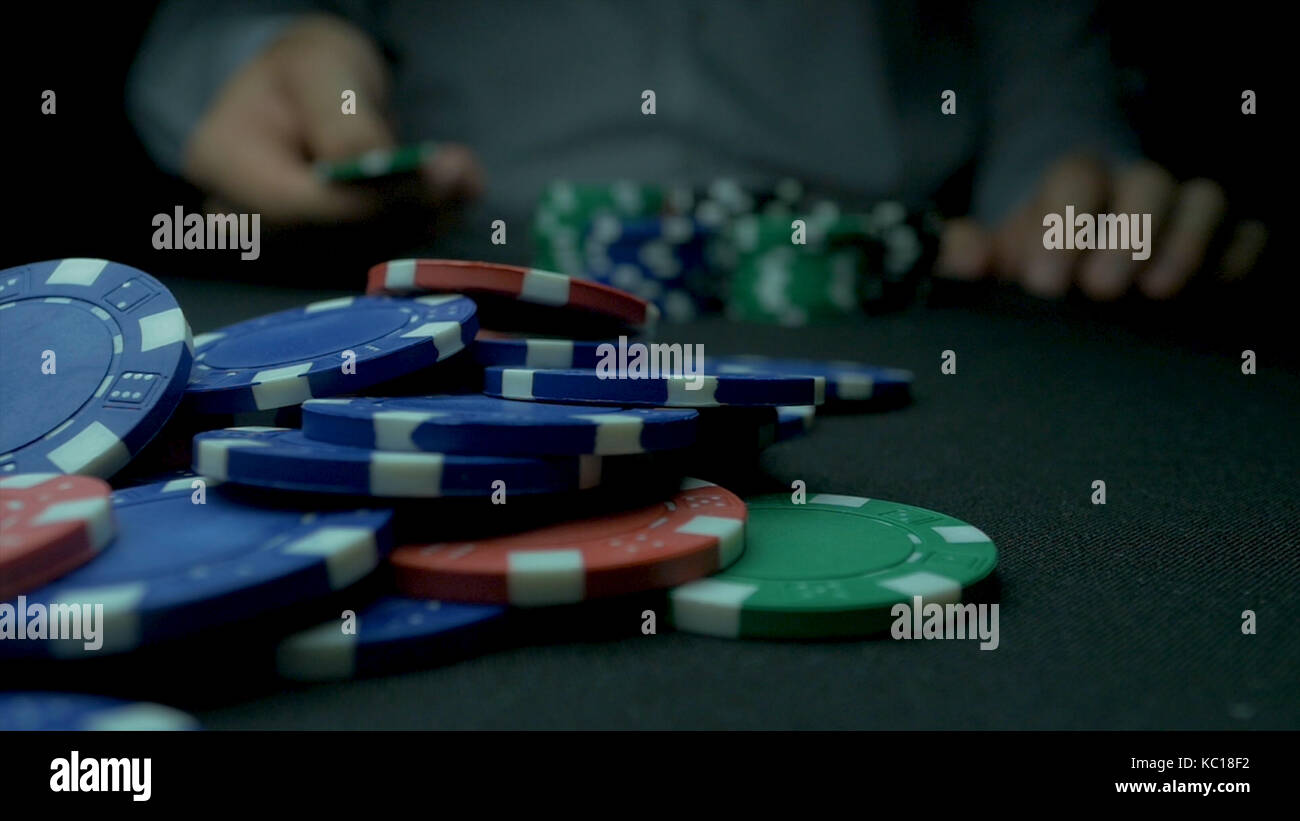 Close-Up of Man Throwing a Poker Chips in slow motion. Close-up of hand ...