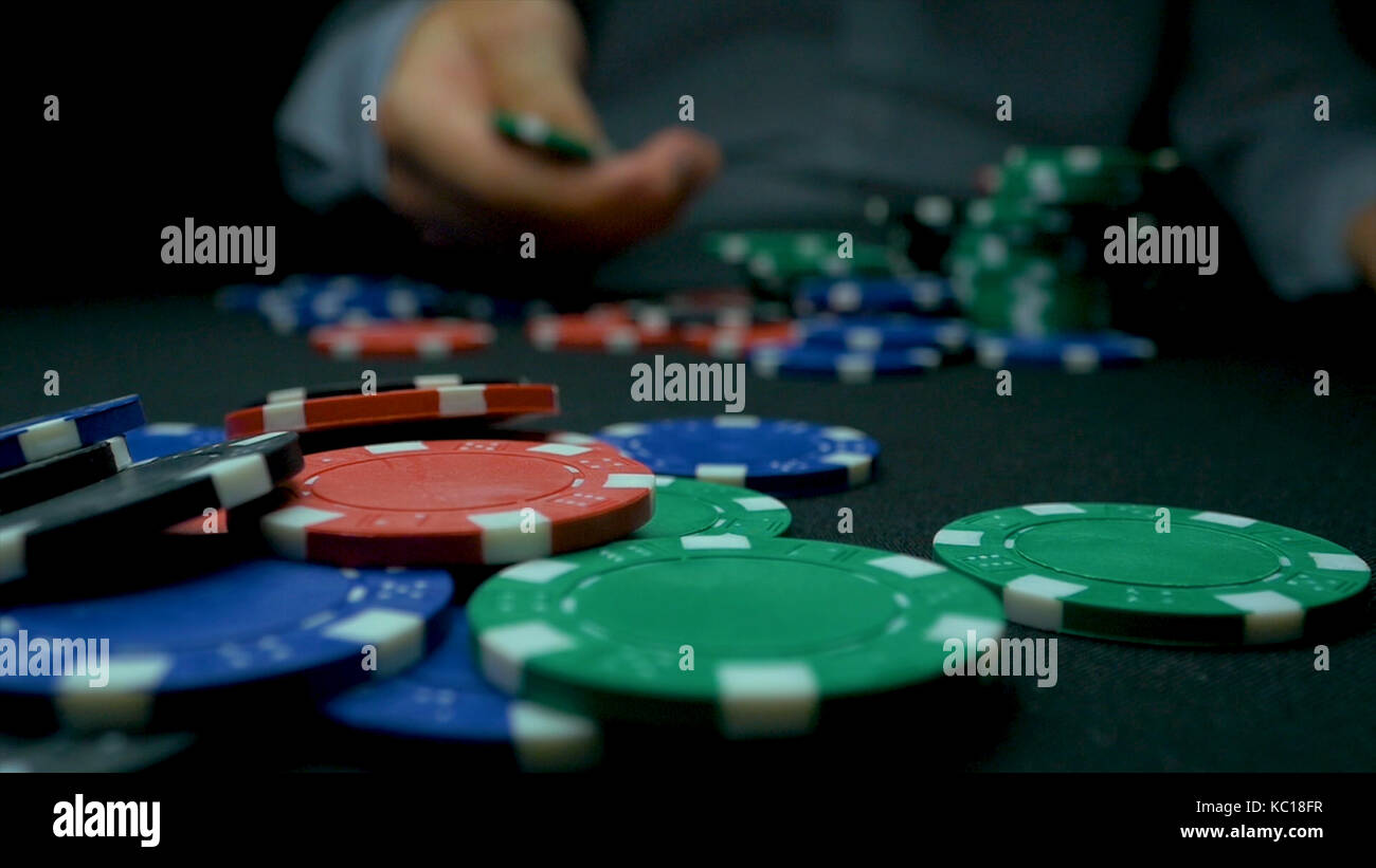 Close-Up of Man Throwing a Poker Chips in slow motion. Close-up of hand ...