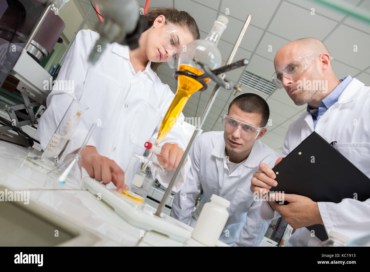 chemist students working with pipette Stock Photo - Alamy