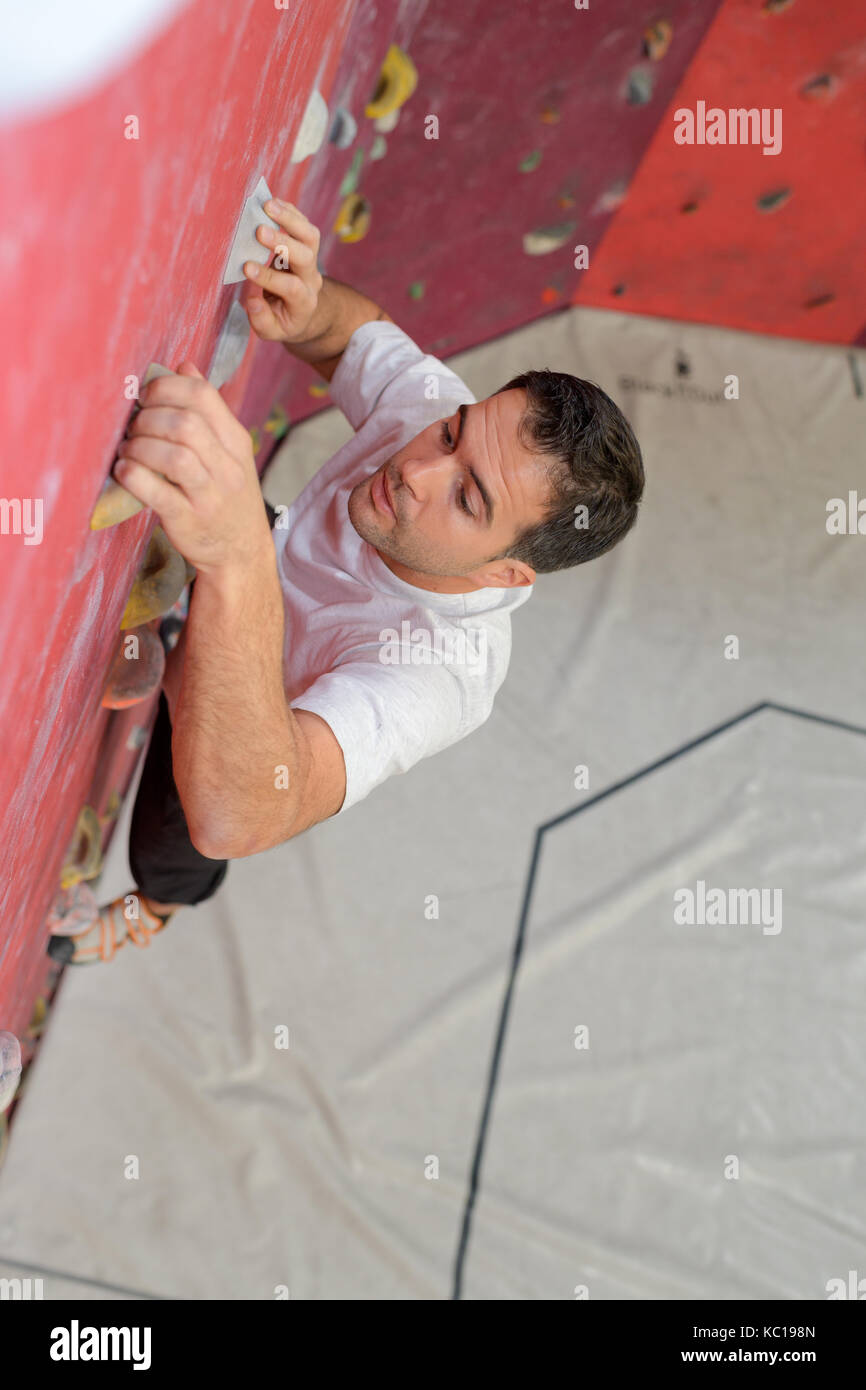 man climbing a wall Stock Photo - Alamy