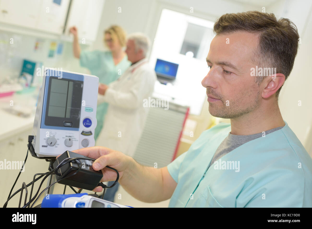 technical staff working at the lab of the hospital Stock Photo - Alamy
