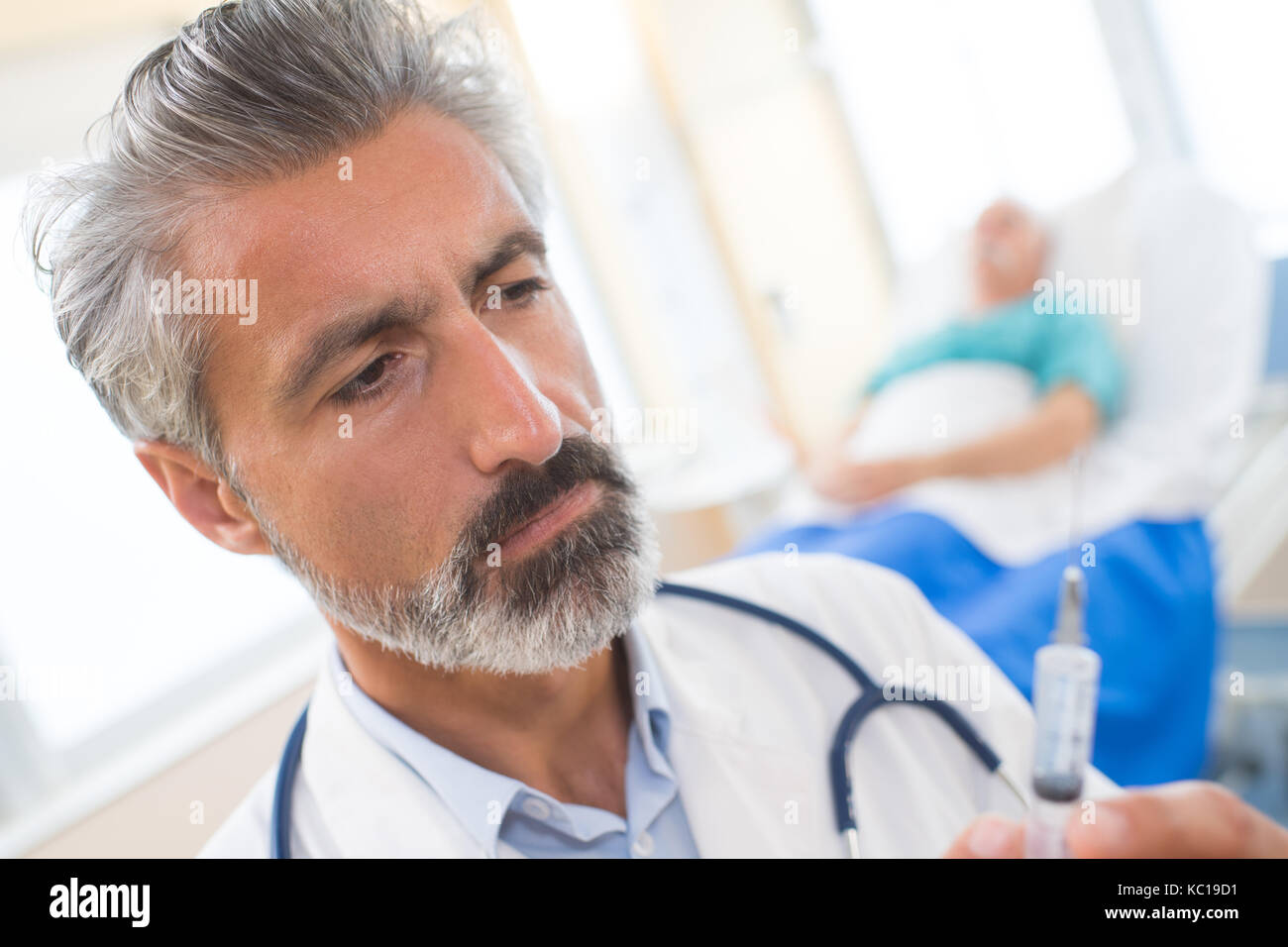 doctor with injection needle Stock Photo - Alamy
