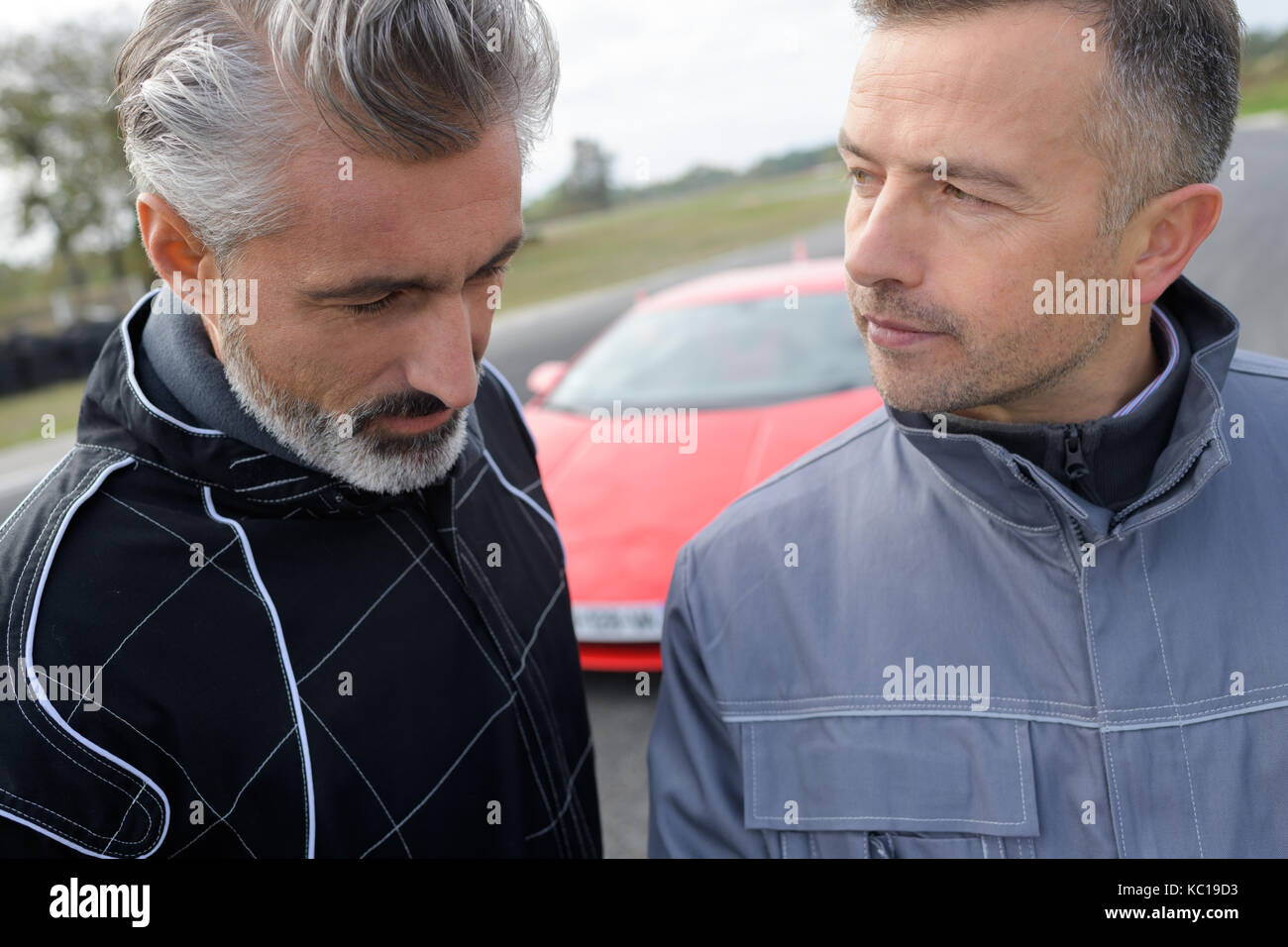 two men and a fast car Stock Photo - Alamy