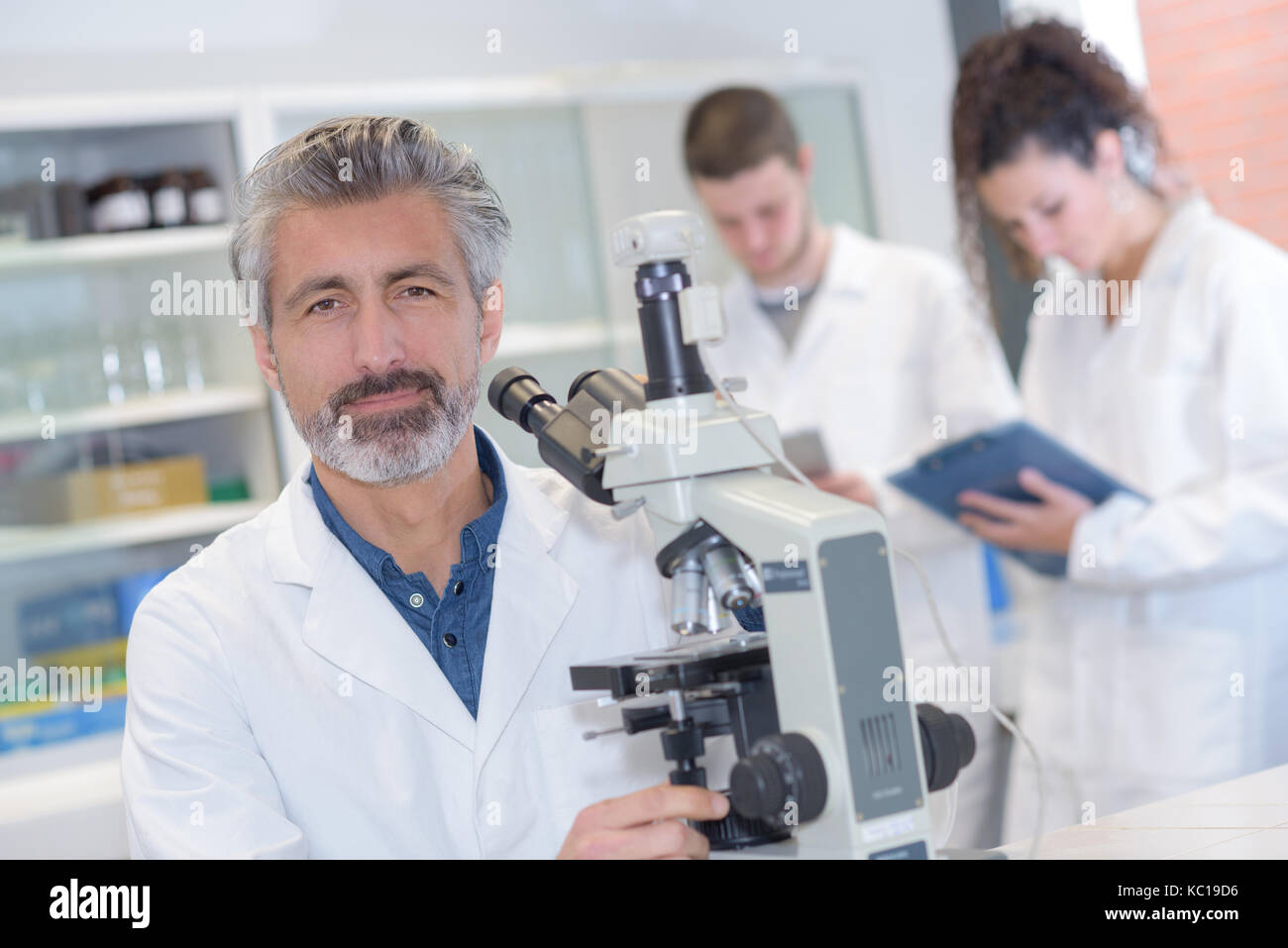 senior chemistry professor in a lab with his colleagues Stock Photo - Alamy