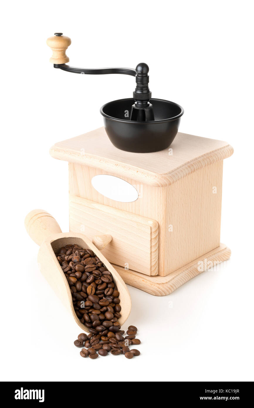 Coffee beans in wooden scoop with wooden coffee bean grinder over white ...