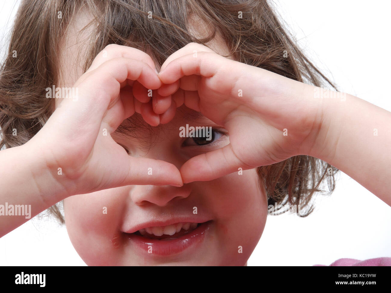 Girl making heart shape with her hands Stock Photo - Alamy