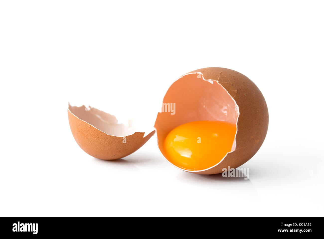 egg yolk in egg shell, cracked egg white isolated on white background ... egg yolk in egg shell, cracked egg white isolated on white background ...