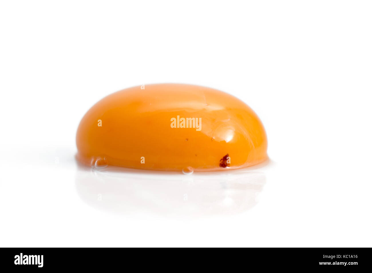 raw egg yolk isolated on white background Stock Photo - Alamy