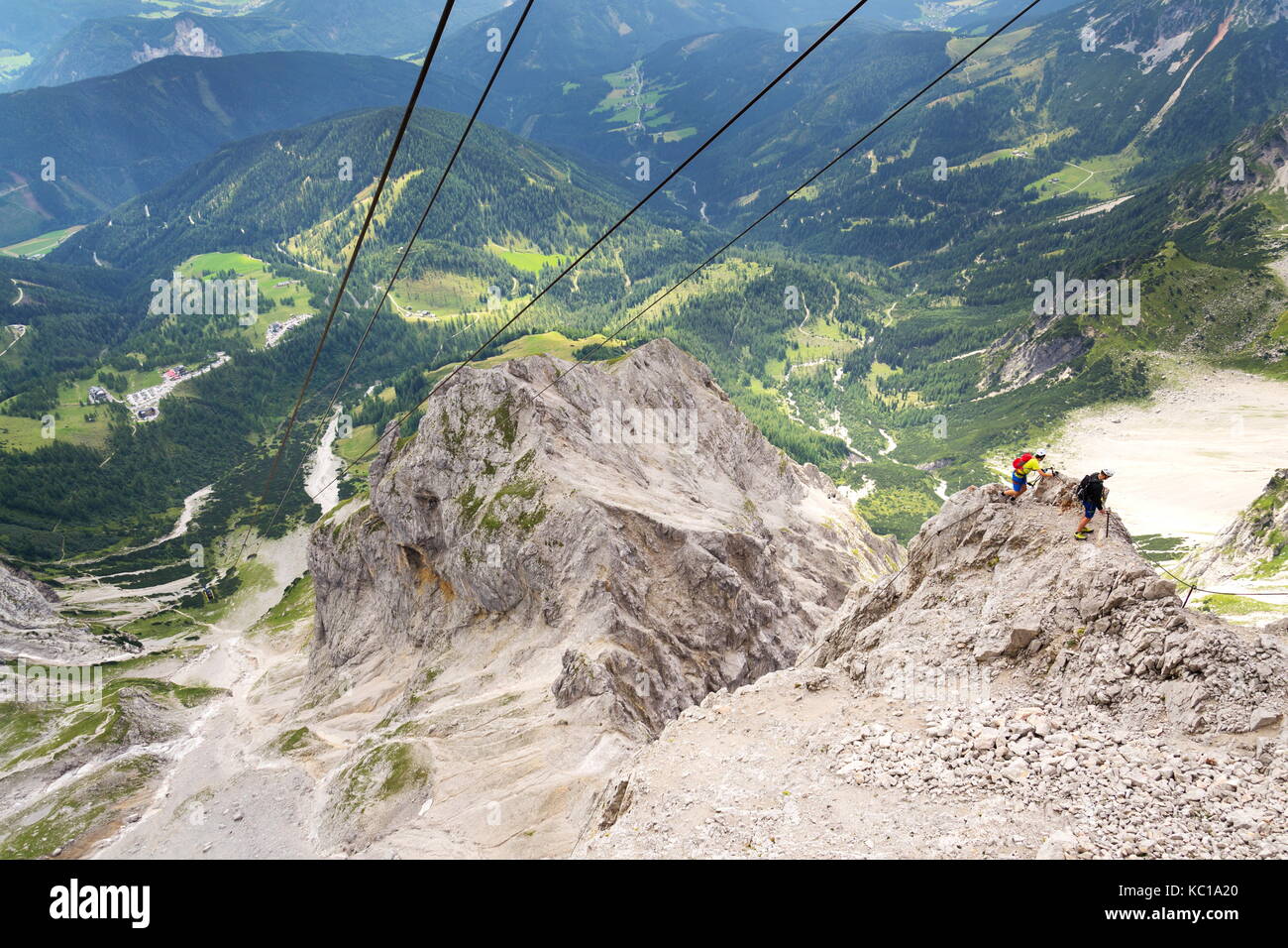People climbing on via ferrata to Dachstein glacier, Austrian Alps ...