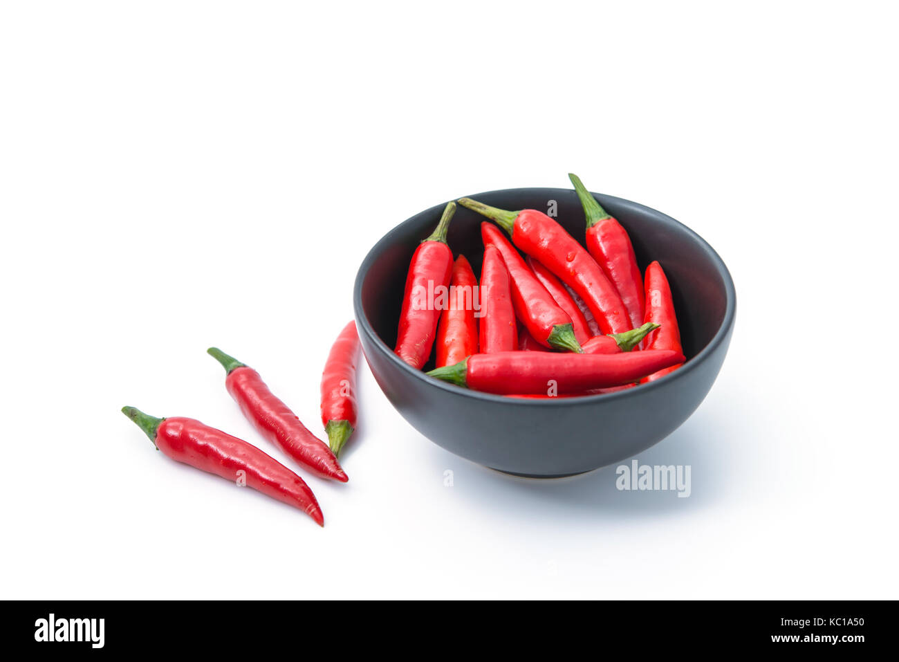 red pepper in a bowl isolated on white background Stock Photo - Alamy