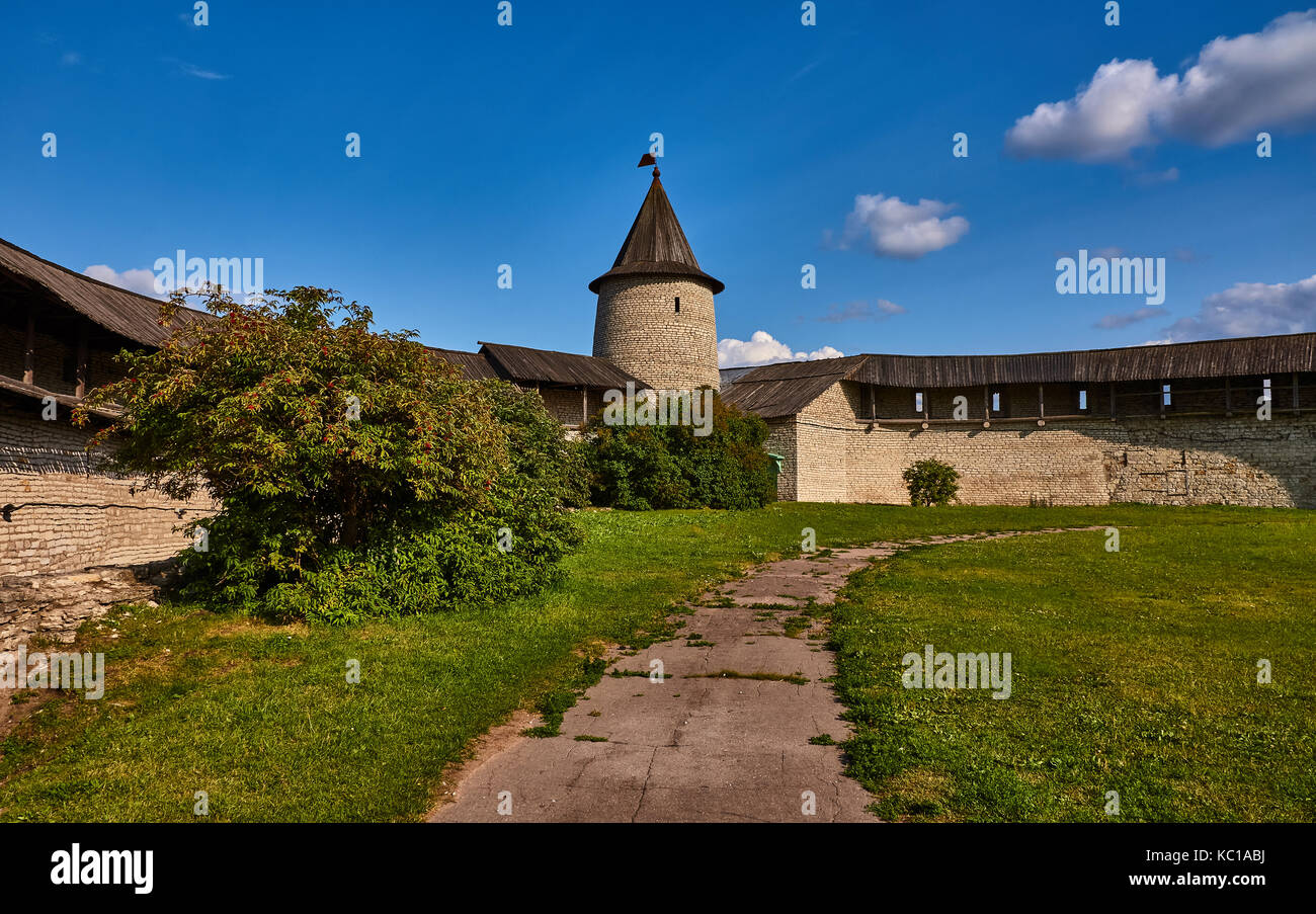 The summer day. Clouds in the sky. Area of the Pskov Kremlin buildings ...
