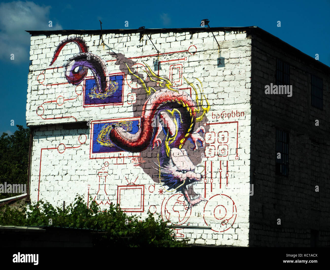 Tbilisi, Georgia - June 6, 2017: Graffiti depicts a dragon with an open ...