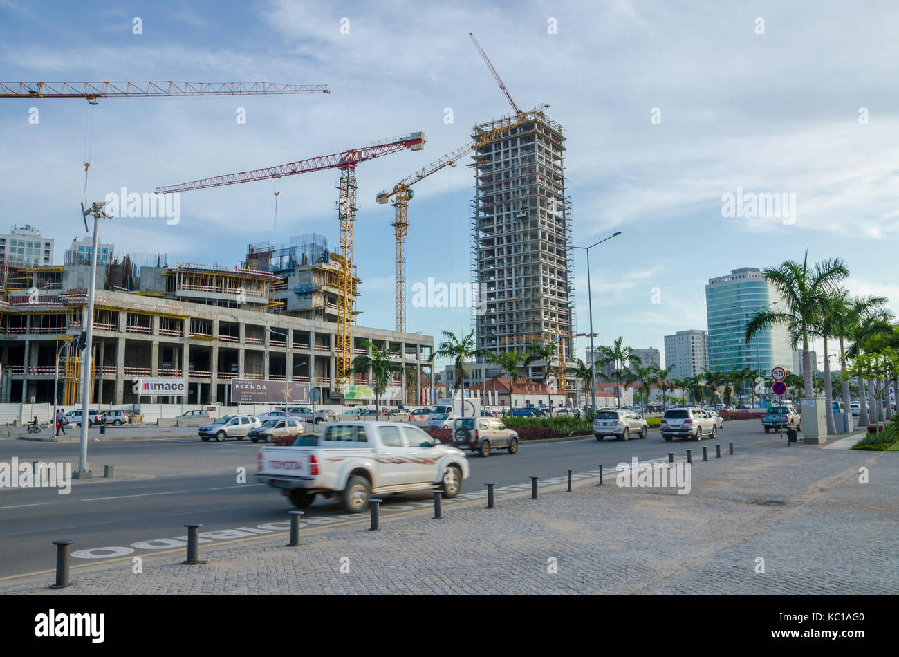 Construction of many modern high rise buildings with large cranes at ...