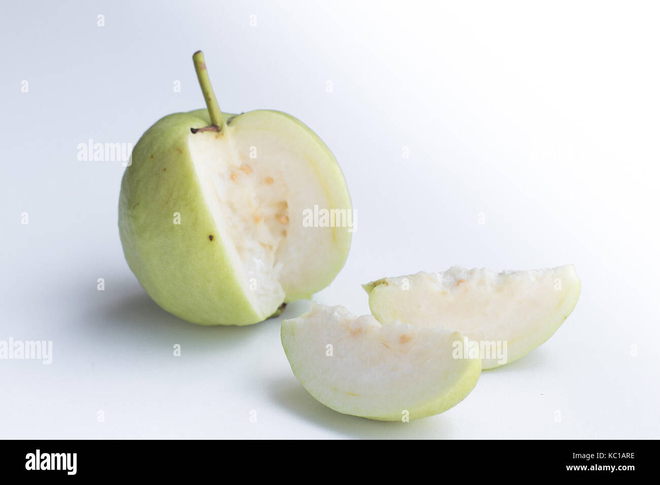 fresh guava with stem on white background.(selective focus Stock Photo ...