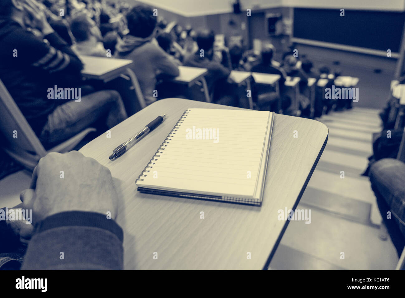 Taking notes at conference Stock Photo - Alamy
