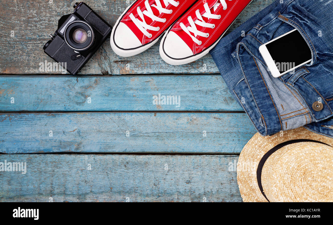 Still life of various items for recreation, clothing, hat, sneakers ...