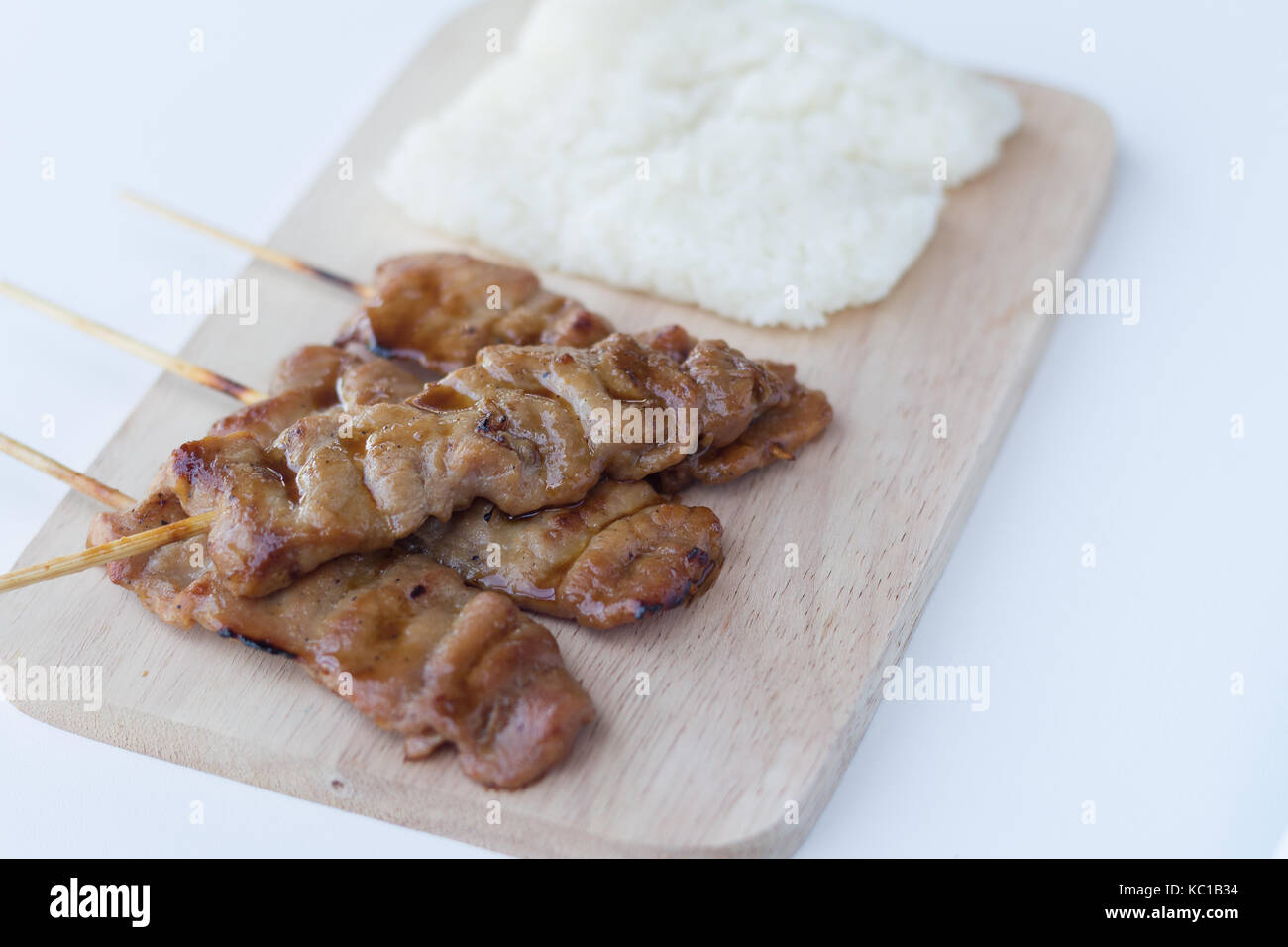 Grilled pork in asian style sticky rice that in Thailand is famous food ...