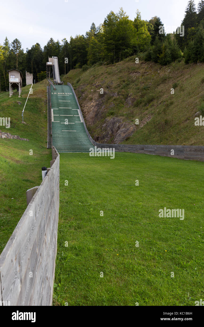 Bottom view of Ski jumping slope and tracks on summer Stock Photo - Alamy