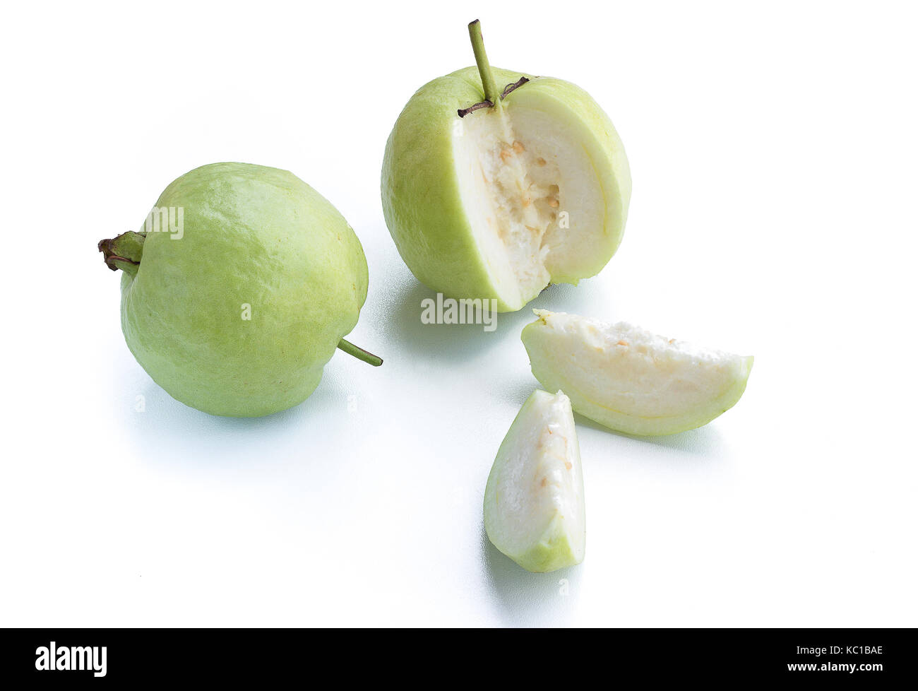 fresh guava with stem on white background Stock Photo - Alamy
