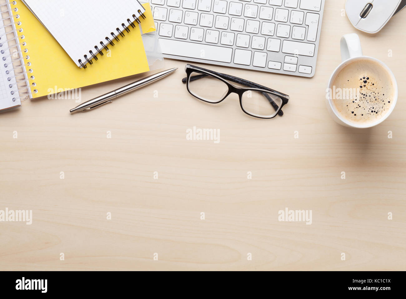 Wooden office desk with computer, coffee and supplies. Tabletop. Top ...
