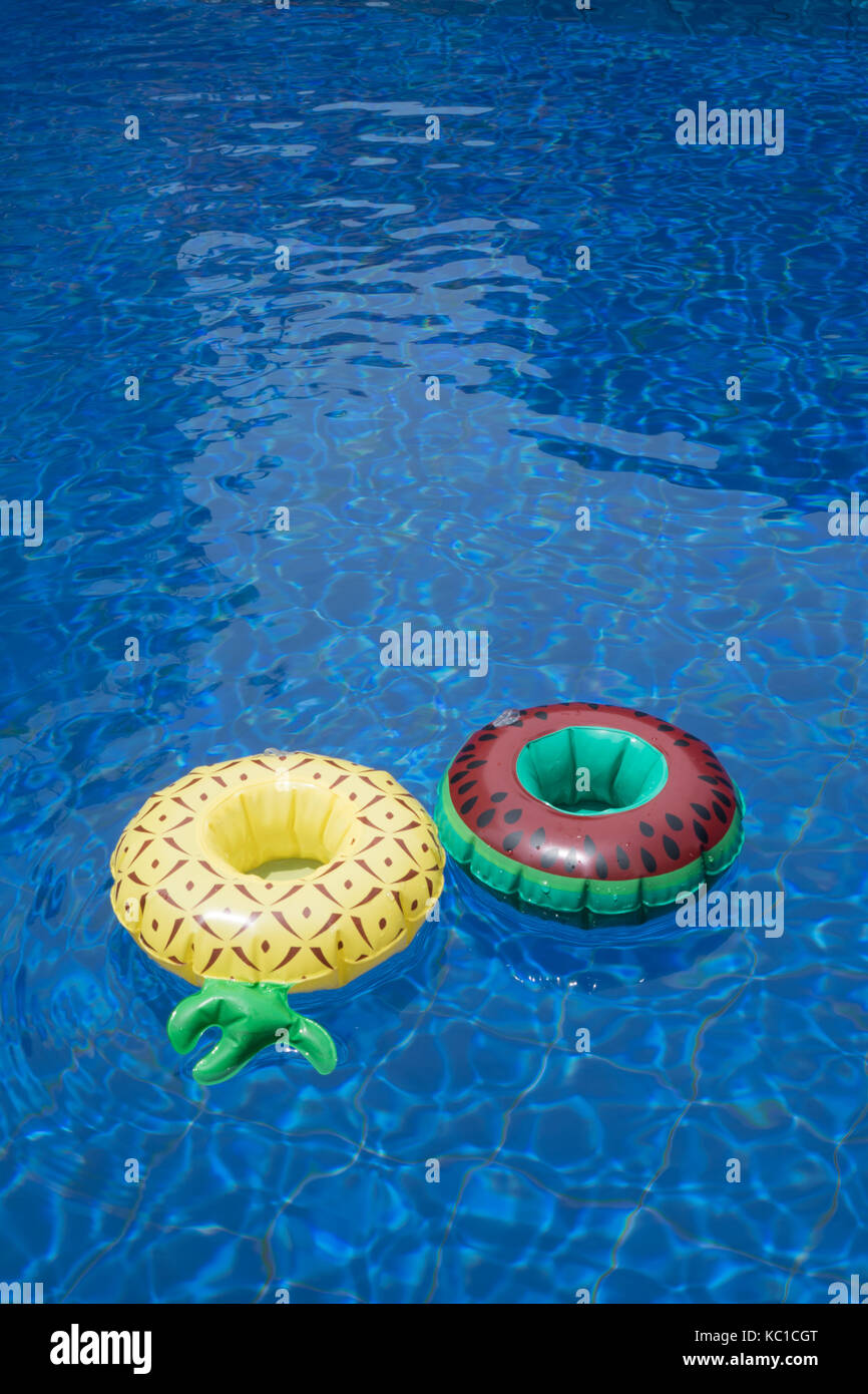 Inflatable cocktail drink holders in the outdoor swimming pool Stock ...