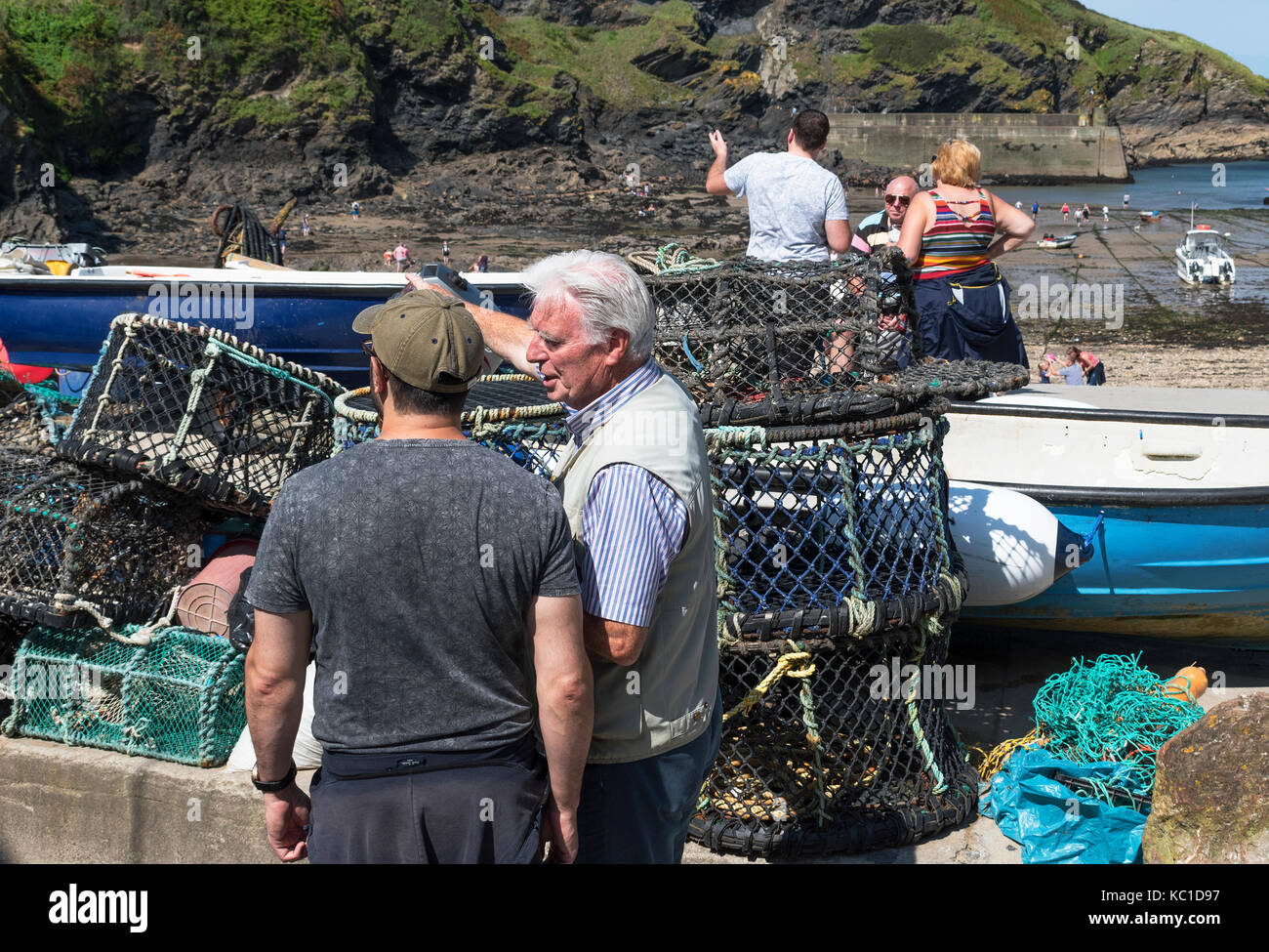 local cornish fishermen at the harbour in port isaac, cornwall, england ...