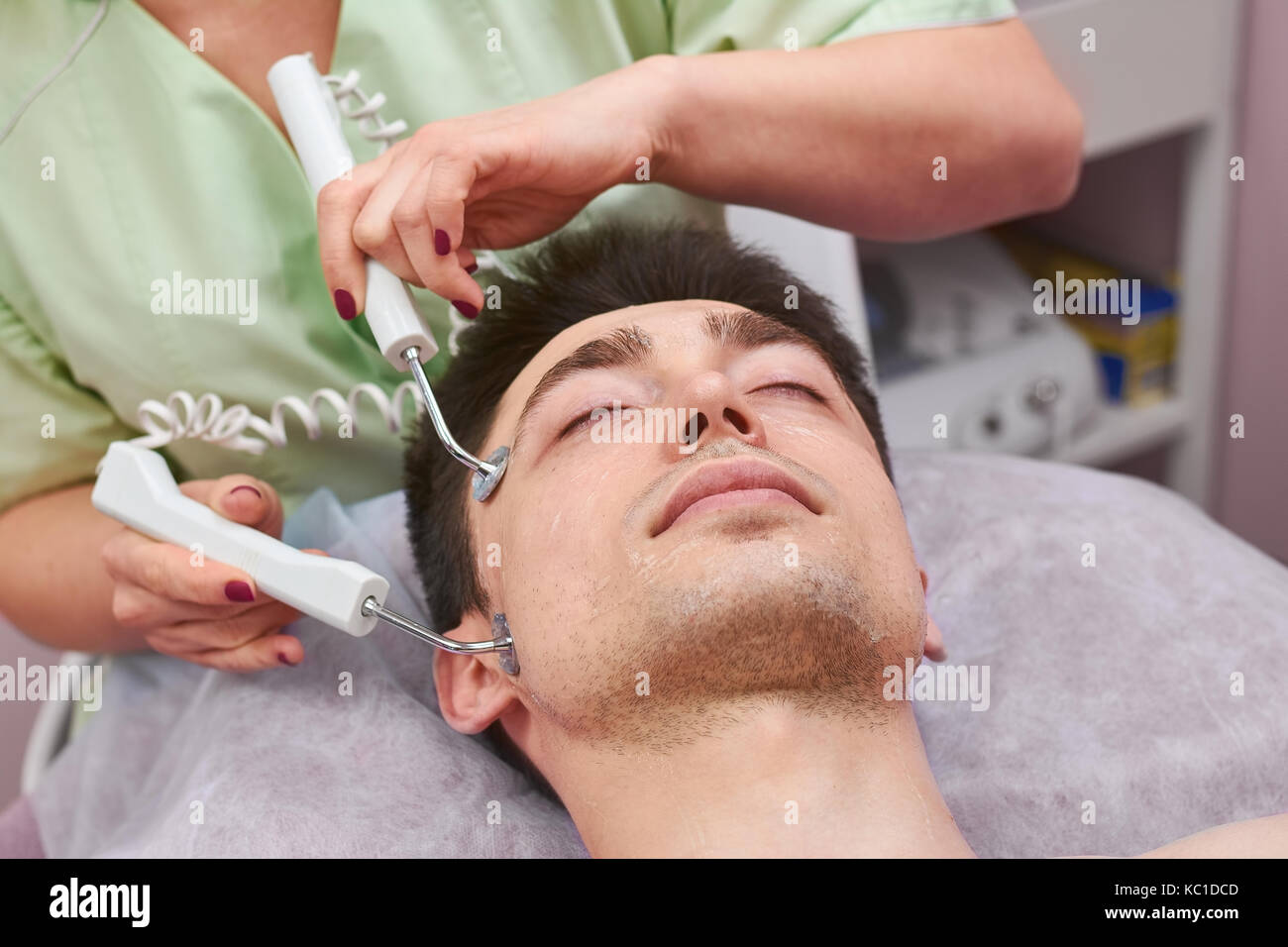 Face of man, microcurrent therapy Stock Photo - Alamy
