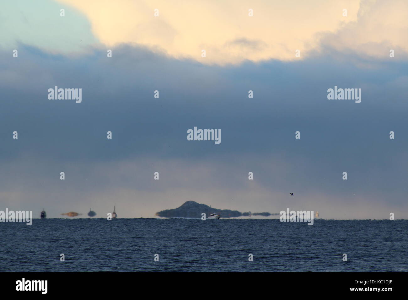 floating island and boats in fjord near Tromso Norway Stock Photo - Alamy