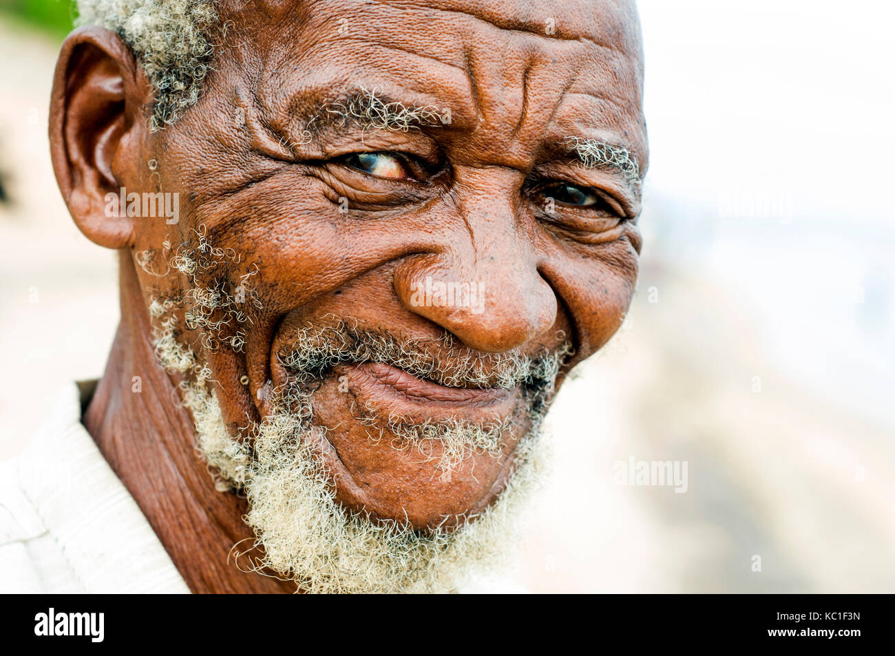Elderly man on beach at Lake Malawi, Salima, Malawi Stock Photo - Alamy