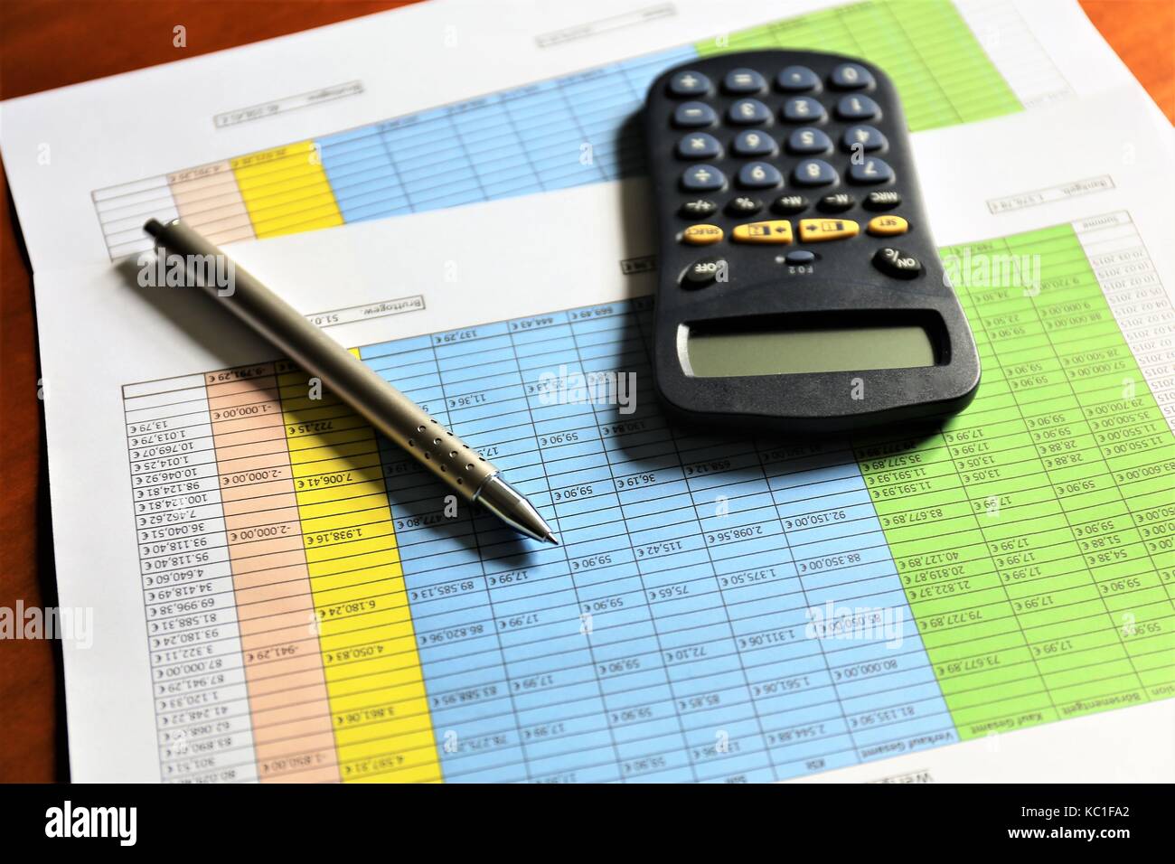 An Image of a paper with calculator and pen Stock Photo - Alamy