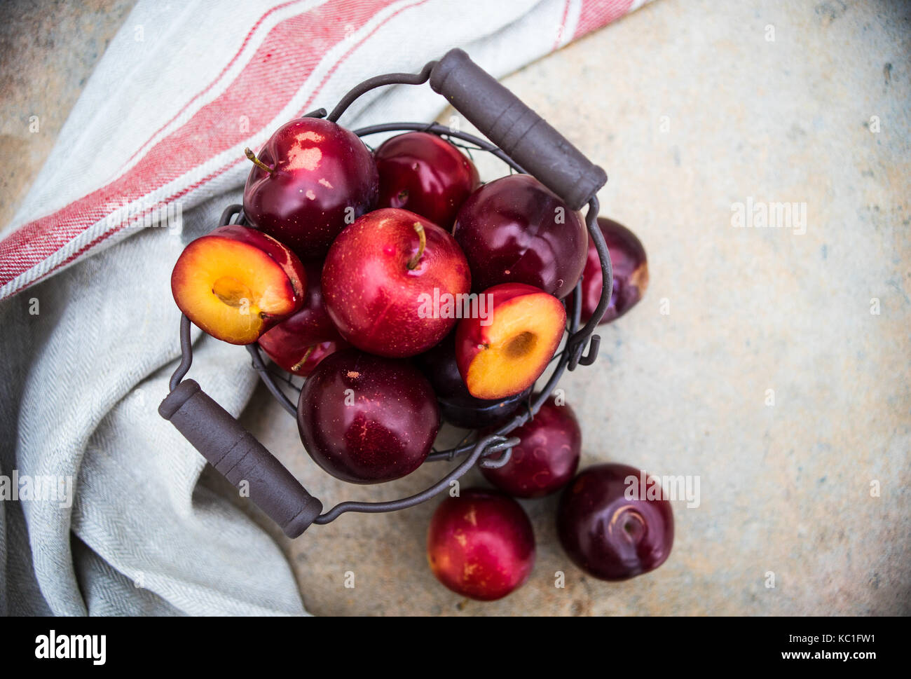 Fresh organic plums on old rustic wooden table Stock Photo - Alamy