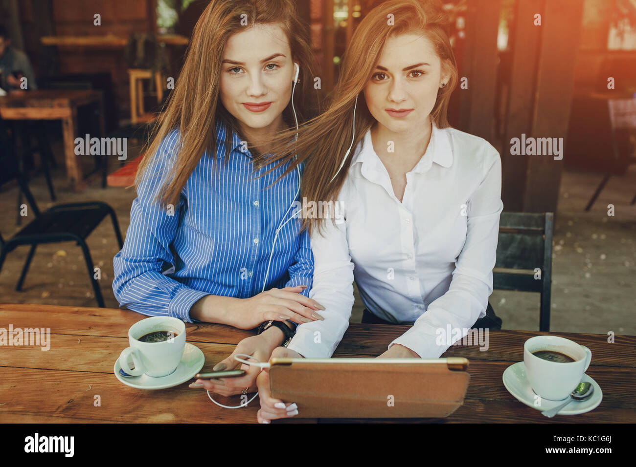 two girls in a cafe Stock Photo - Alamy