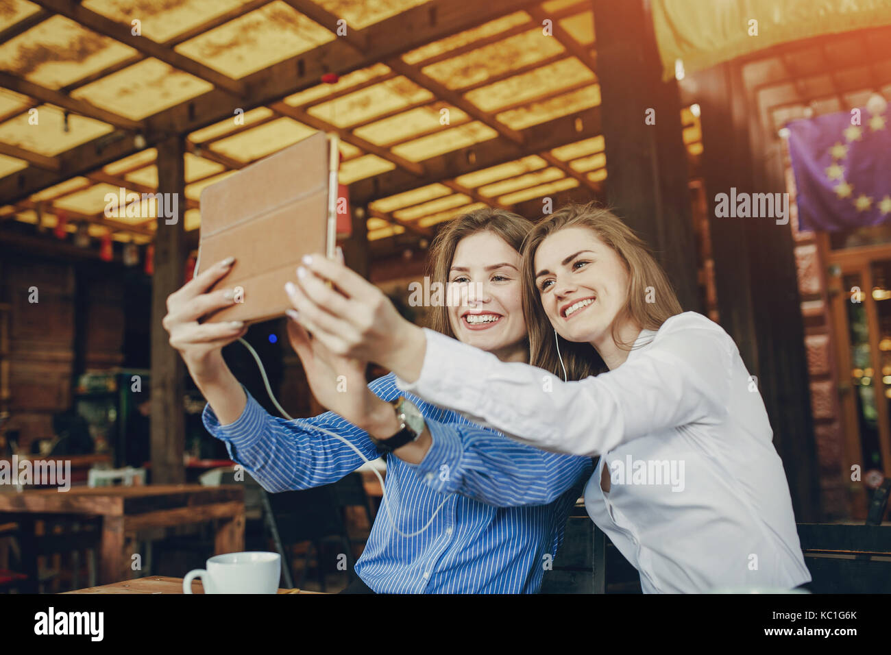 two girls in a cafe Stock Photo - Alamy