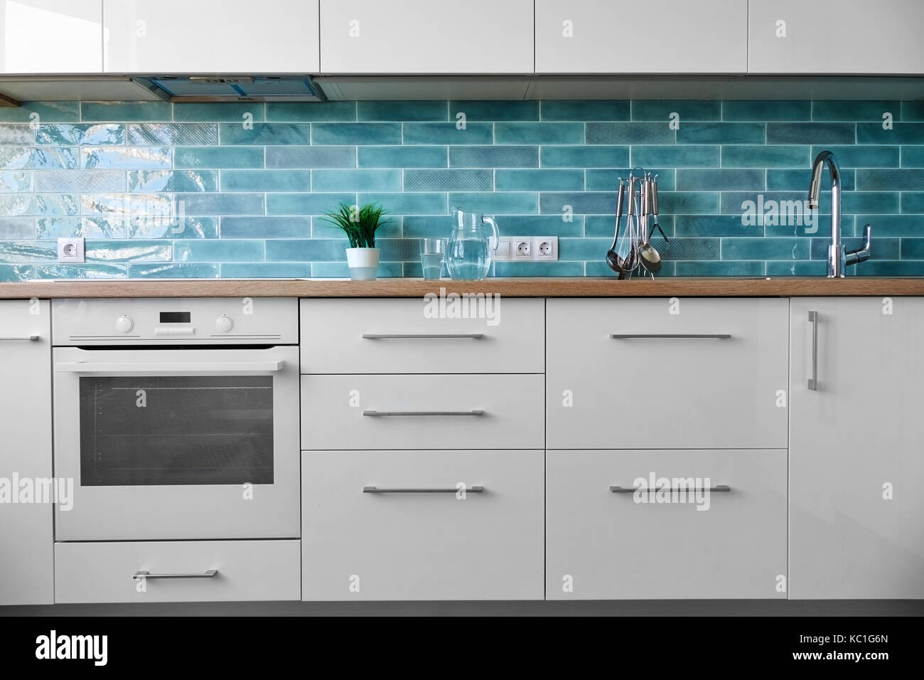 Modern white kitchen a background Stock Photo - Alamy