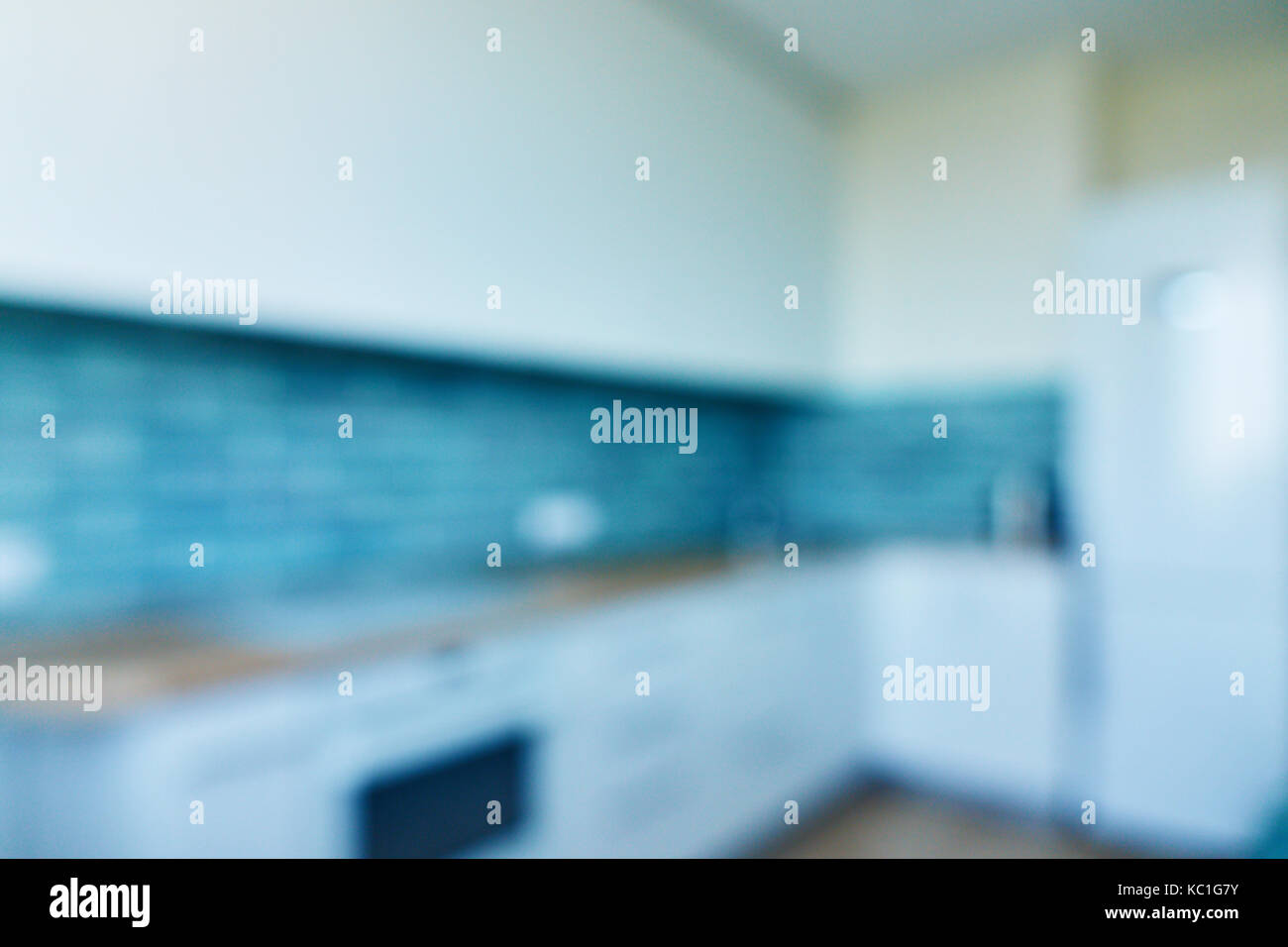 Blur background, white kitchen with blue ceramic tiles Stock Photo - Alamy