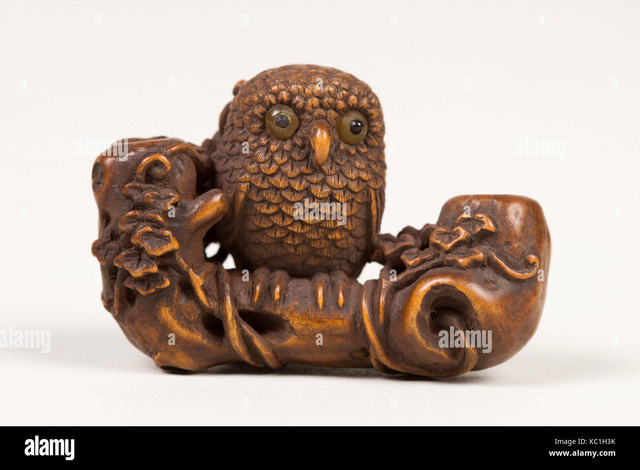 Netsuke of Owl on a Branch, 19th century, Japan, Wood; inlaid glass ...
