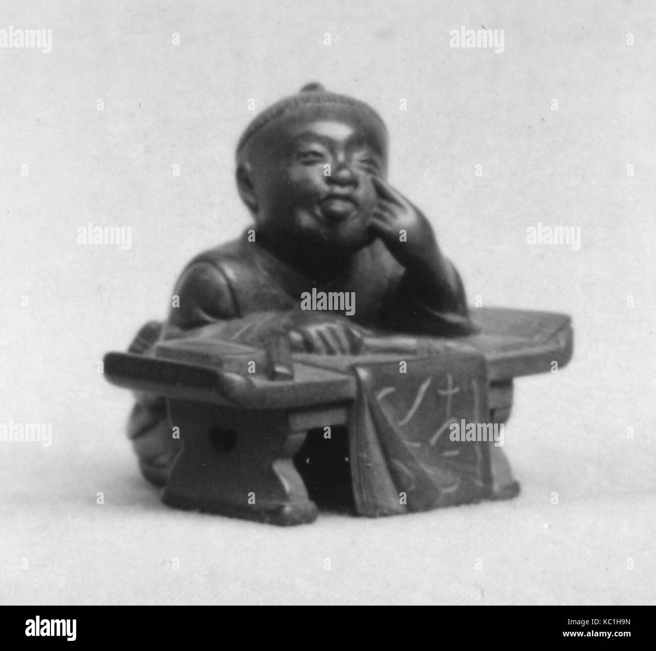 Netsuke of Boy Writing, 19th century, Japan, Wood, H. 1 1/8 in. (2.9 cm ...