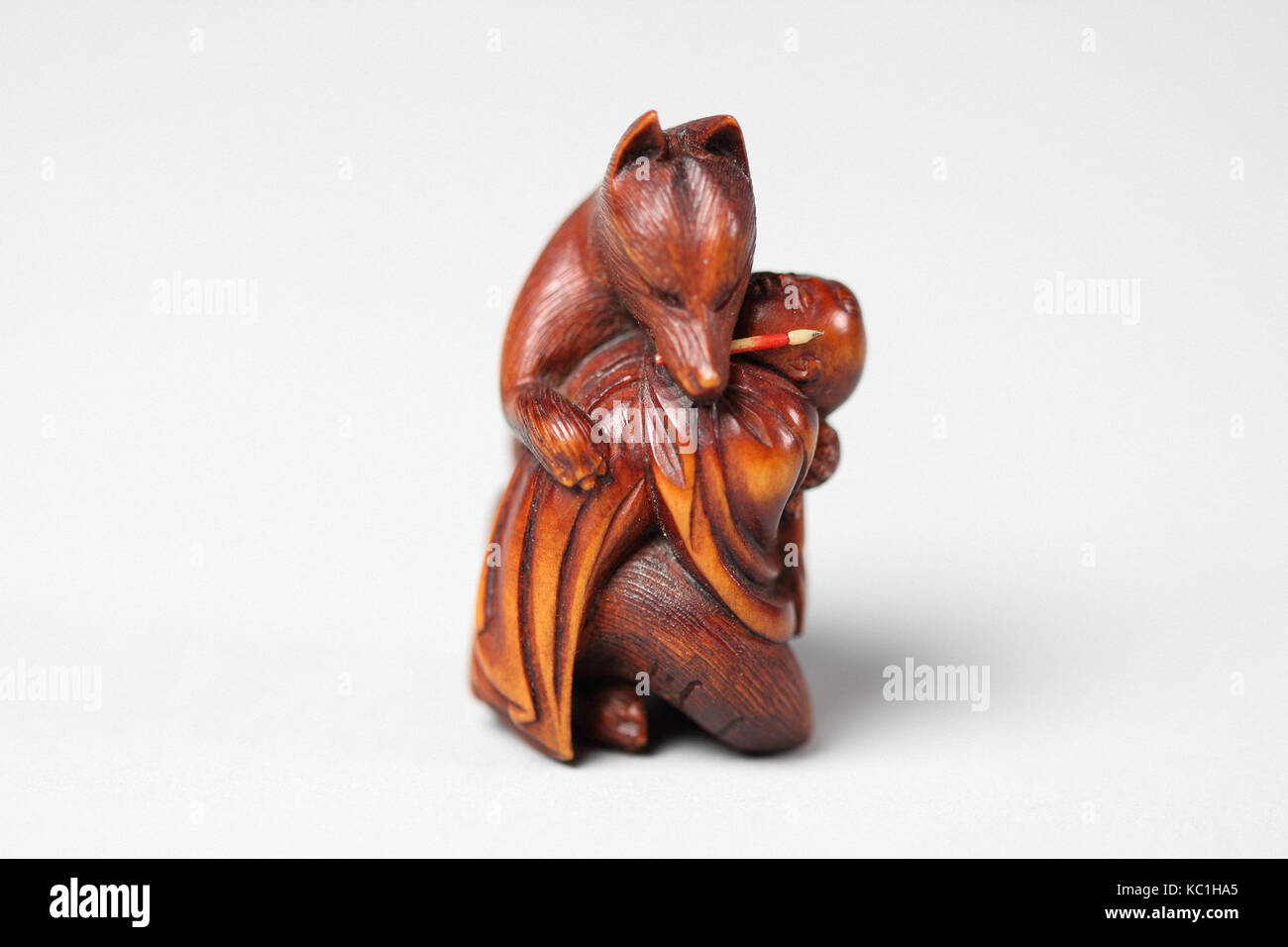 Netsuke of Fox Holding Baby and with Brush in Mouth from the Kabuki ...