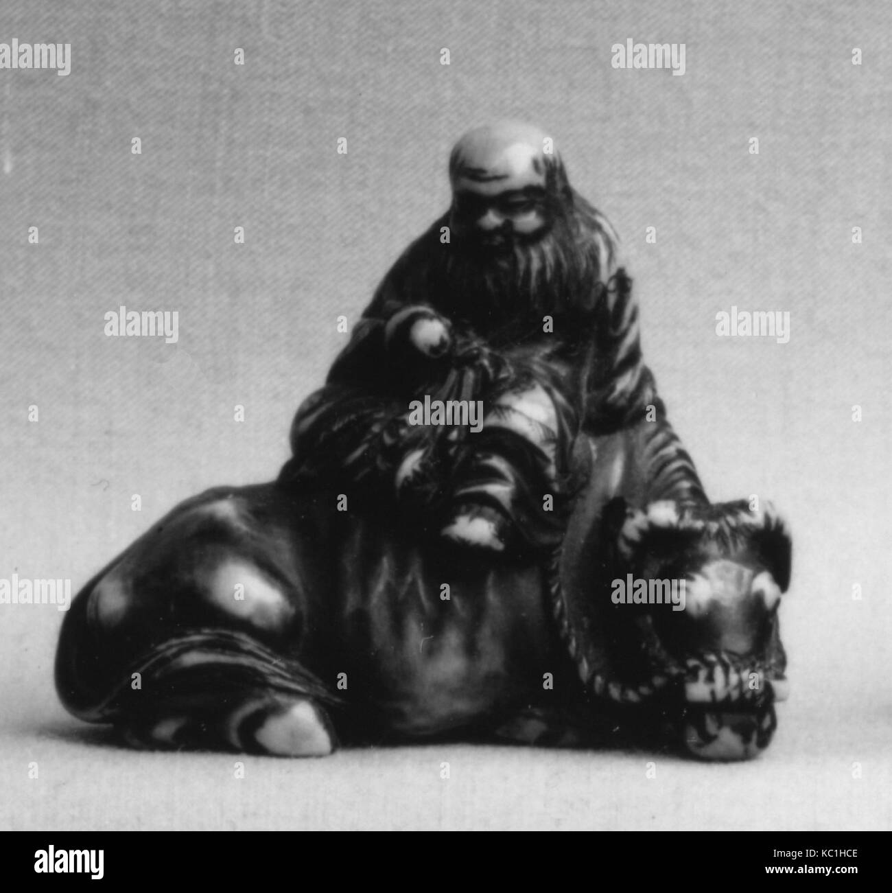 Netsuke of Man Sitting on a Recumbent Ox, 19th century Stock Photo - Alamy