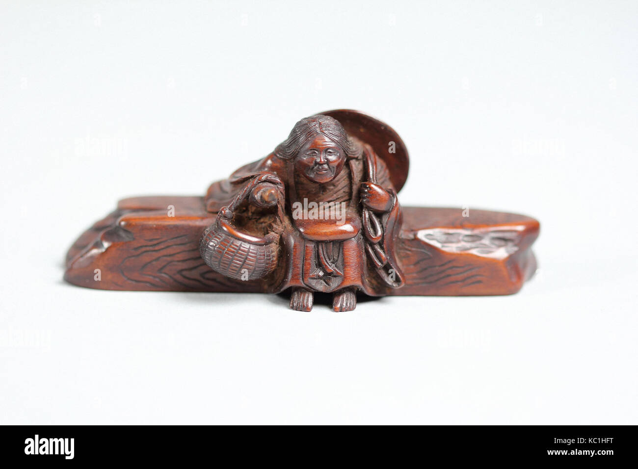 Netsuke of Woman Sitting on a Log, 19th century, Japan, Wood, H. 1 3/16 ...