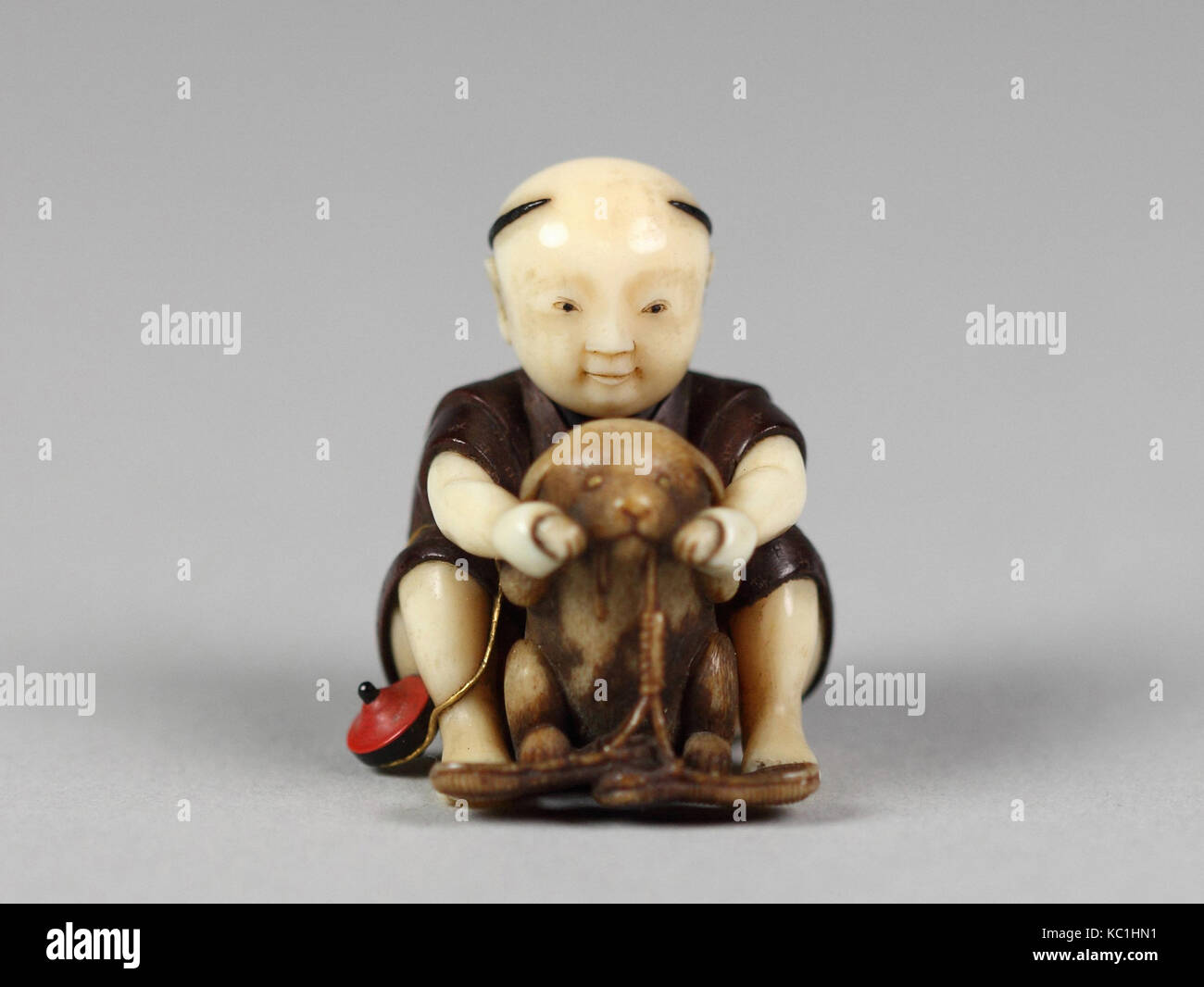 Netsuke of Boy Playing with a Dog, 19th century, Japan, Wood and ivory ...