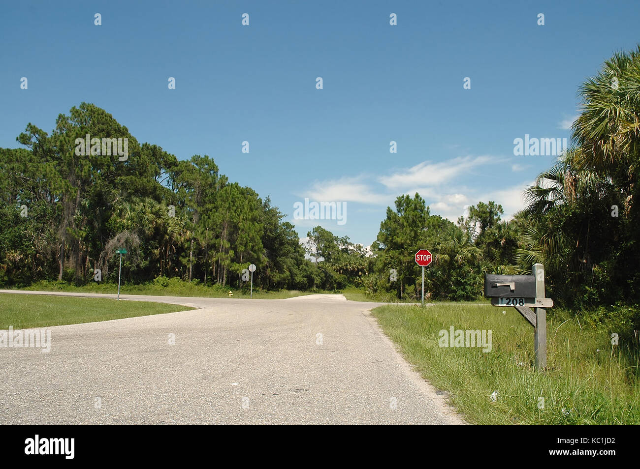 Quiet country crossroad with a stop sign Stock Photo - Alamy