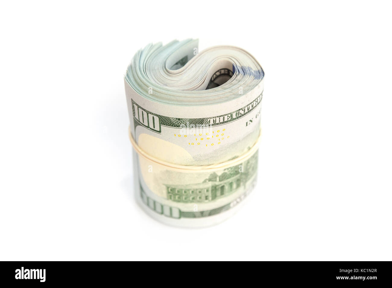 United States official currency, roll of One Hundred Dollars stands ...