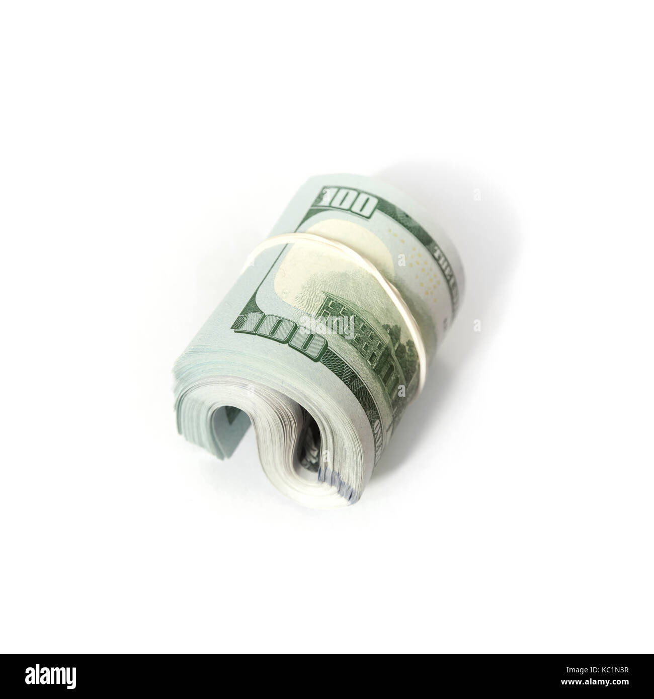 United States official currency, roll of One Hundred Dollars lays ...