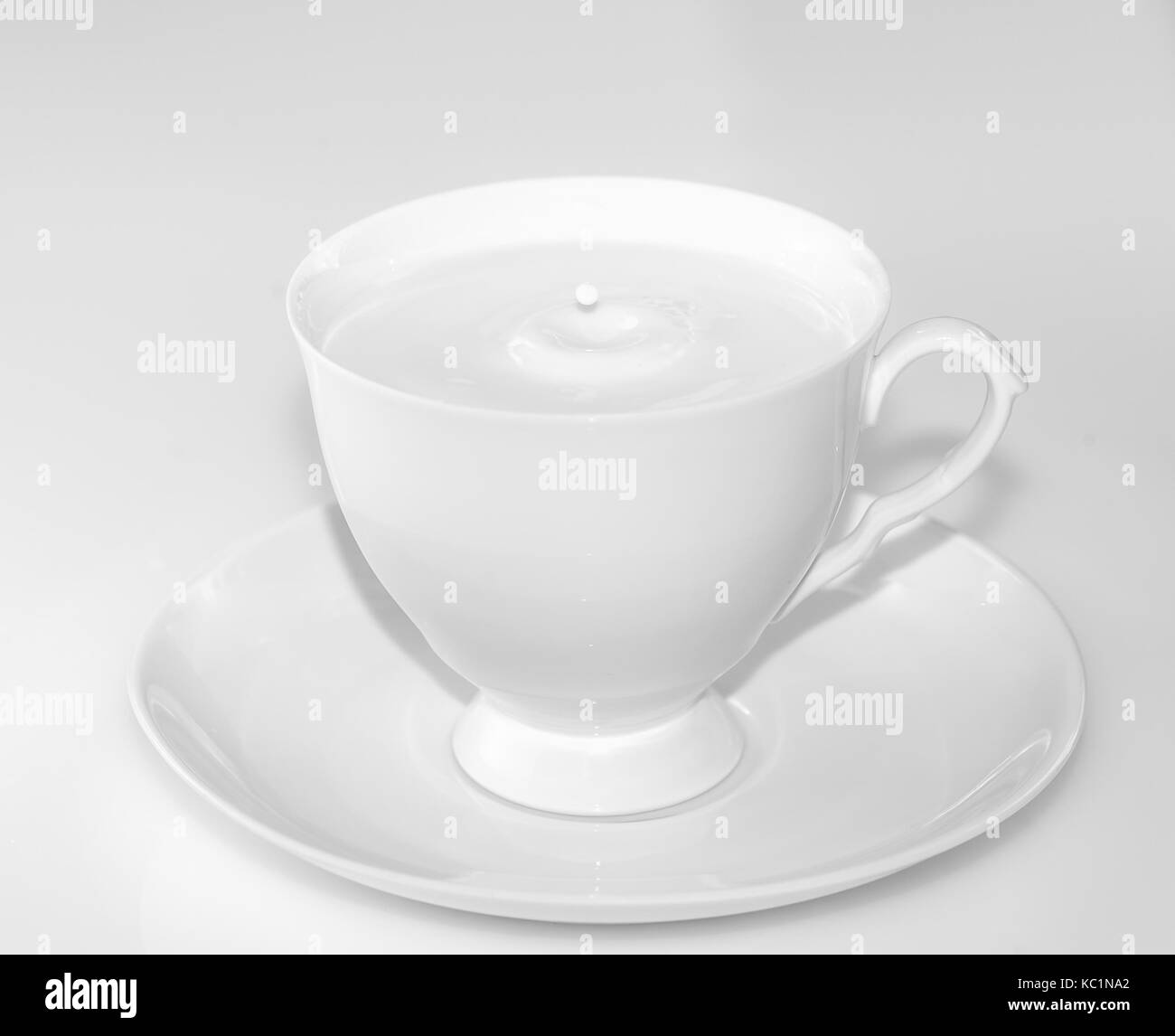 Tea cup with milk drop hi-res stock photography and images - Alamy